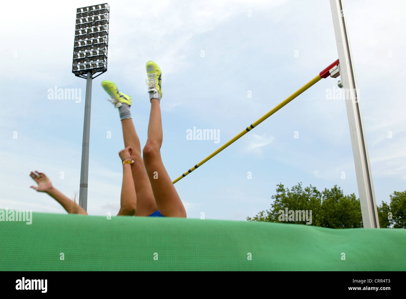 Youth woman in the high jump, watch Olympics Stock Photo - Alamy