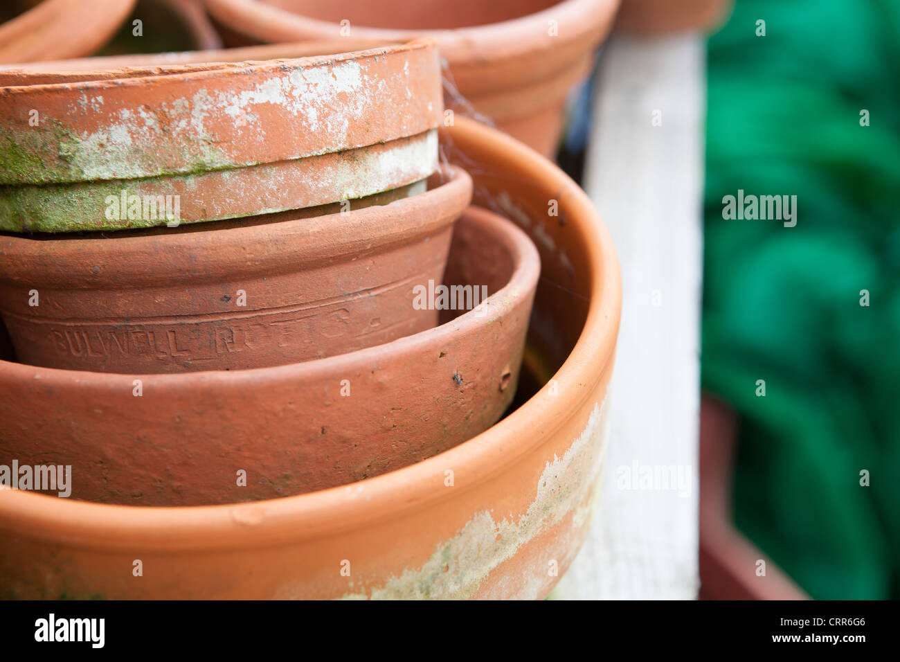 A large stack of old terracotta plant pots for gardening Stock Photo ...
