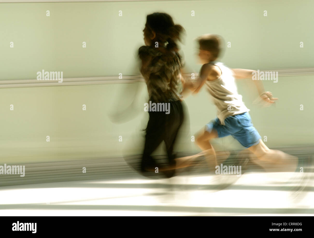 Girl and boy run a race Stock Photo - Alamy