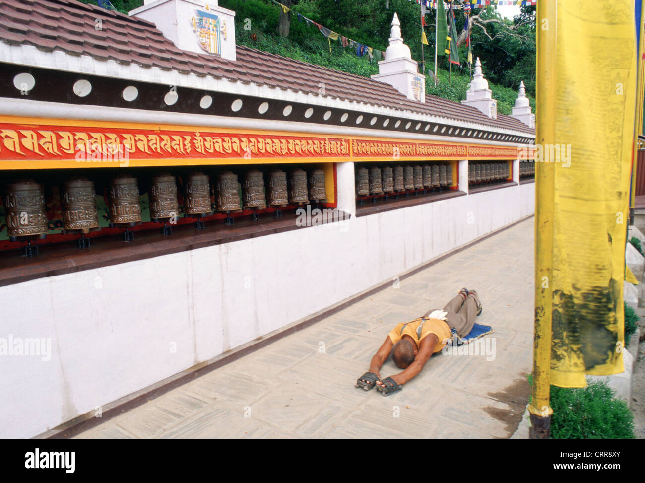 Buddhist man circumambulating around the stupa ( Nepal Stock Photo - Alamy