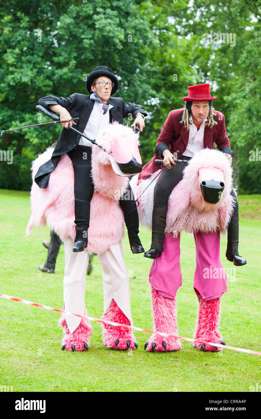 Entertainers wearing pink flamingo costumes at the Ambleside olympic ...