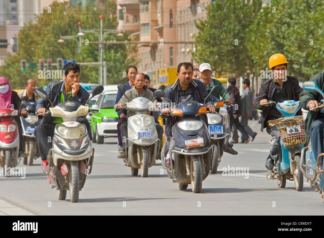A compressed perspective view of people on scooters travelling along a ...