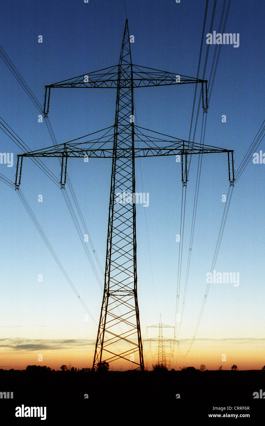 Electricity pylon in evening light Stock Photo - Alamy