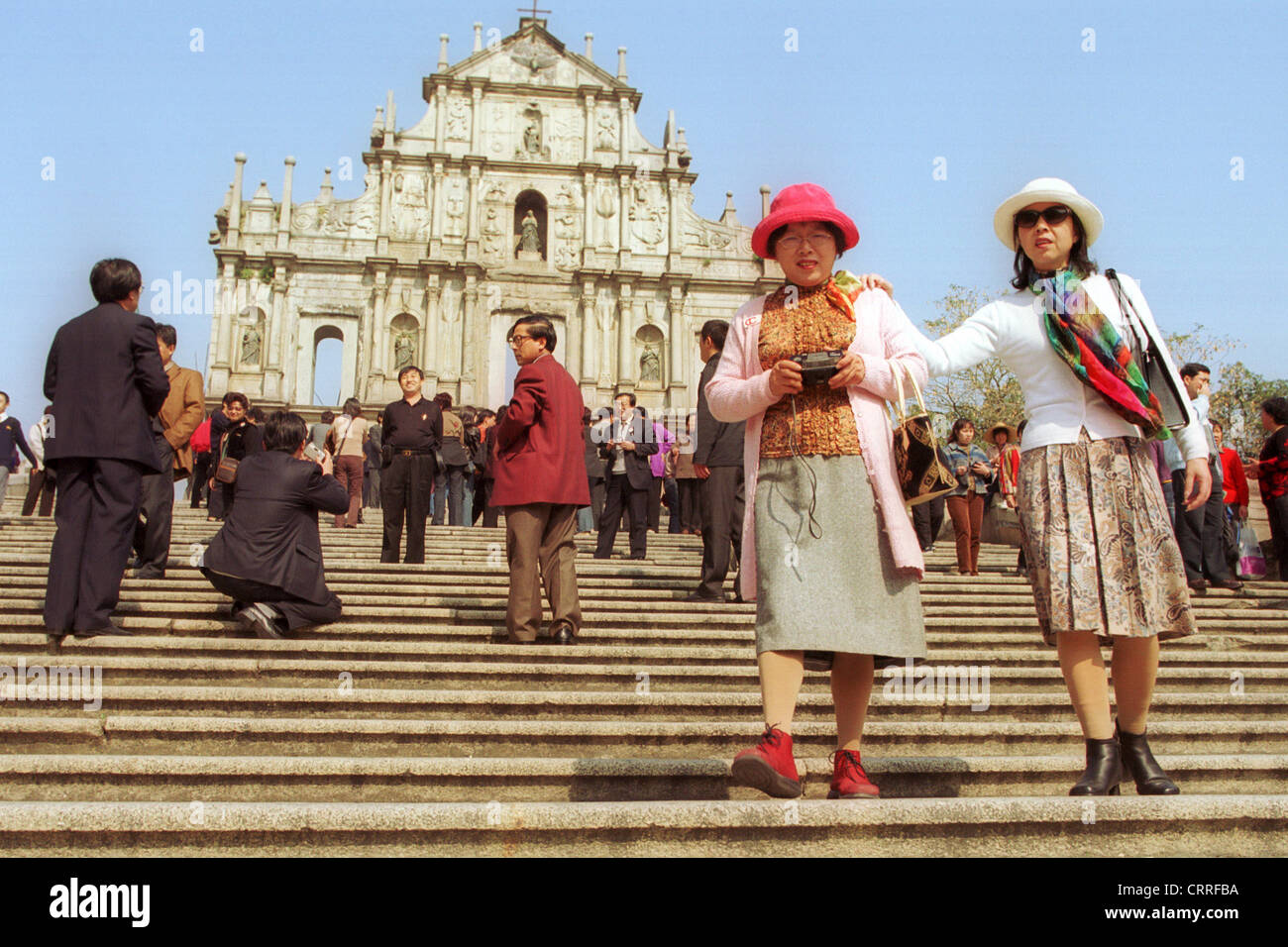 Chinese tourists on the steps of the ruins of St. Paul's Church in ...