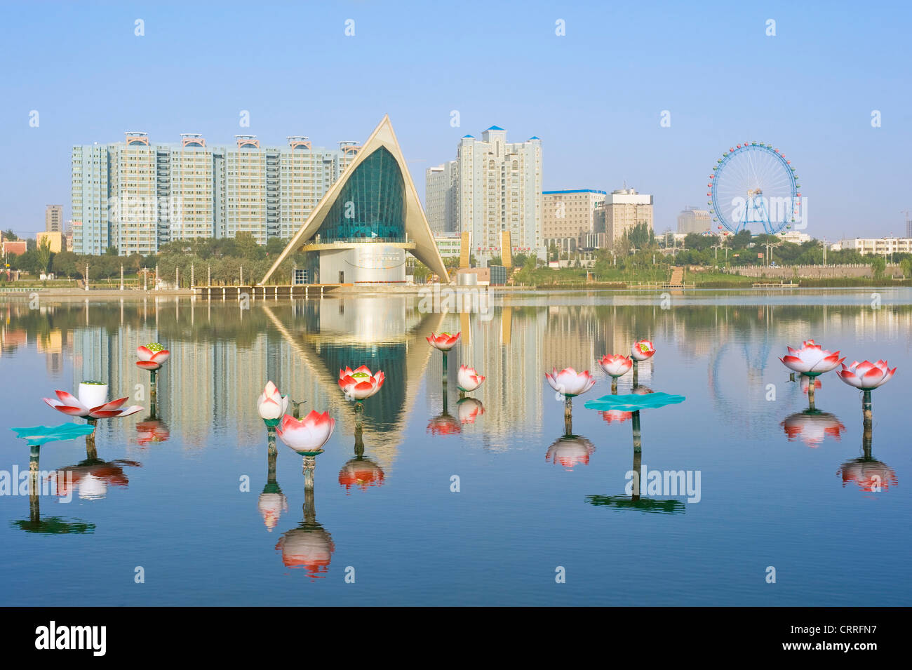 A view of the pavillion in Donghu Park with Kashgar cityscape behind ...