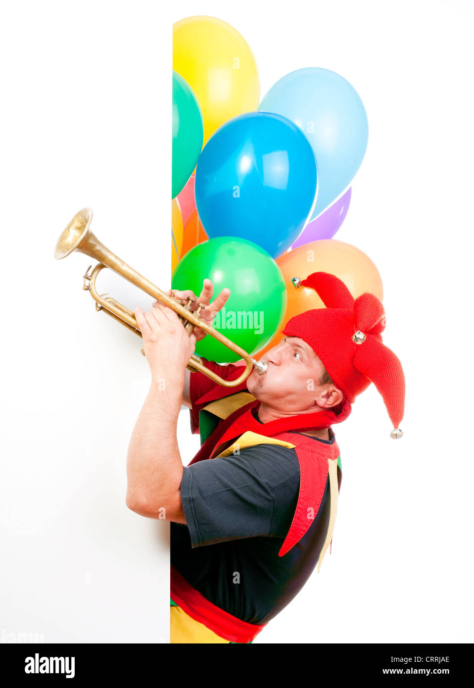 jester - entertaining figure in typical costume blowing trumpet Stock ...