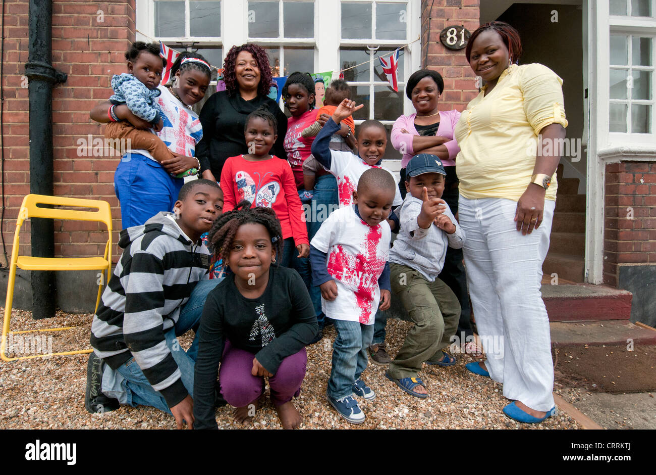 Large family posing outside their home Stock Photo - Alamy