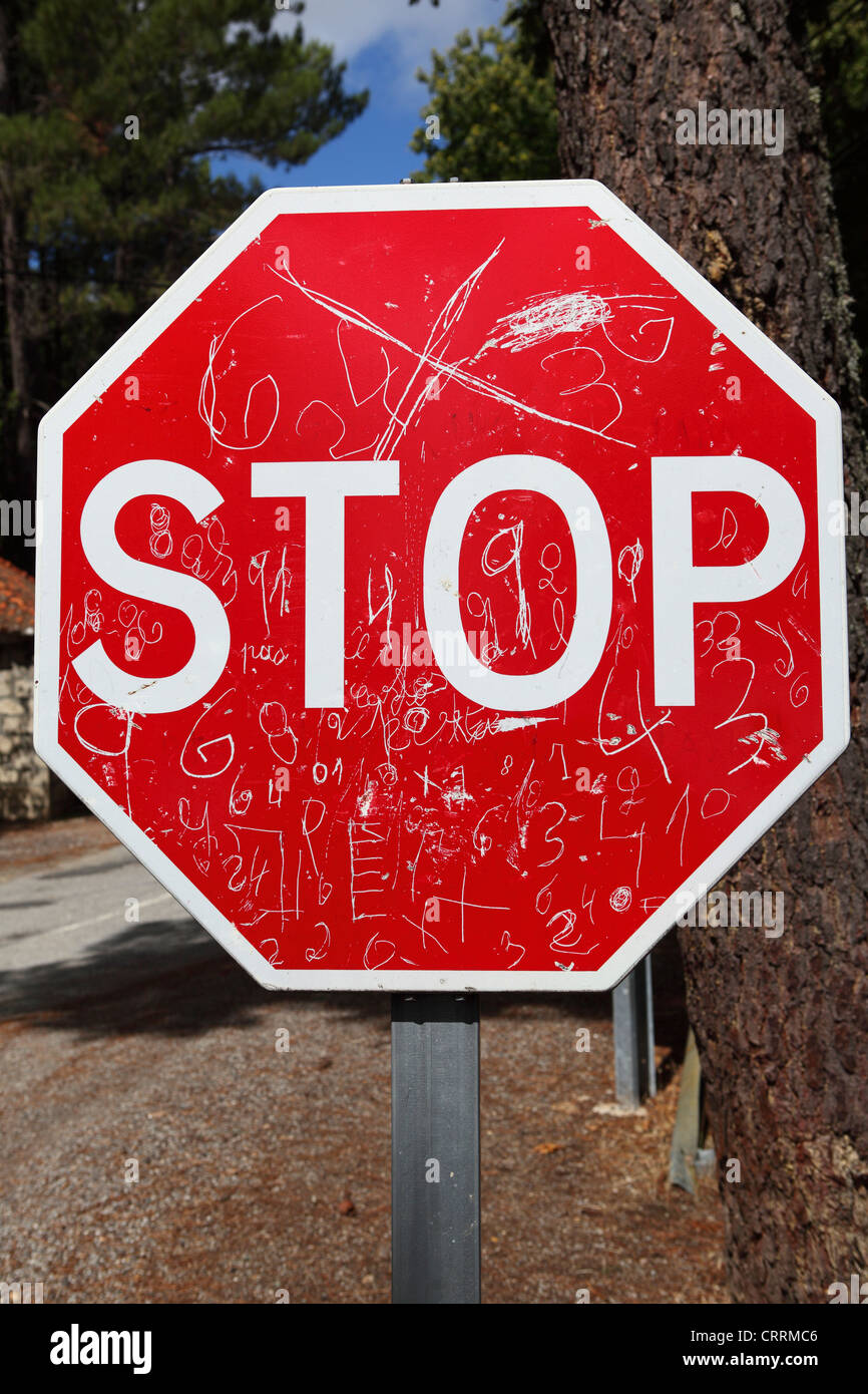A graffiti marked Stop sign at Manteigas, Portugal Stock Photo - Alamy