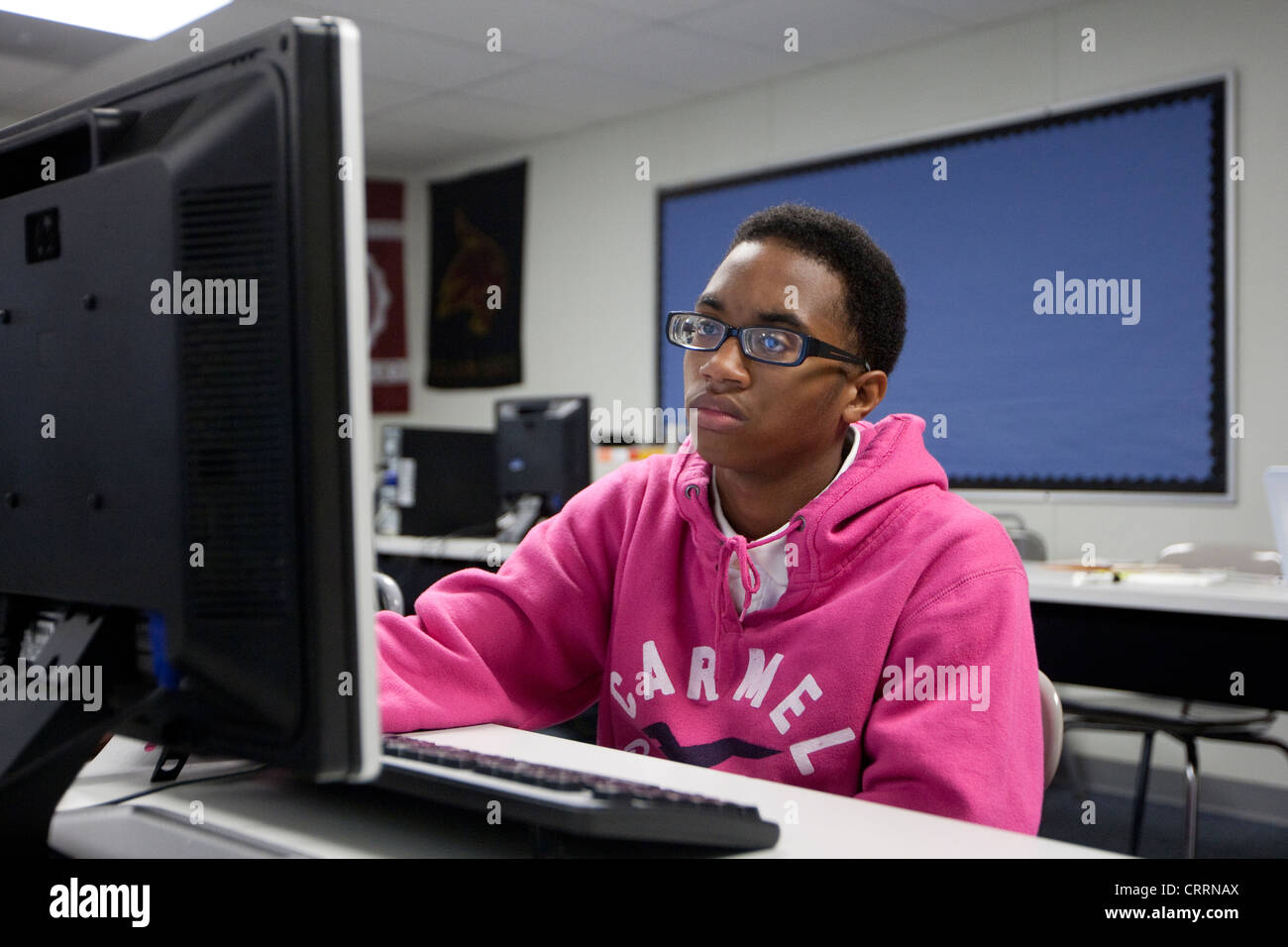 African-American student in computer lab at a public charter high ...
