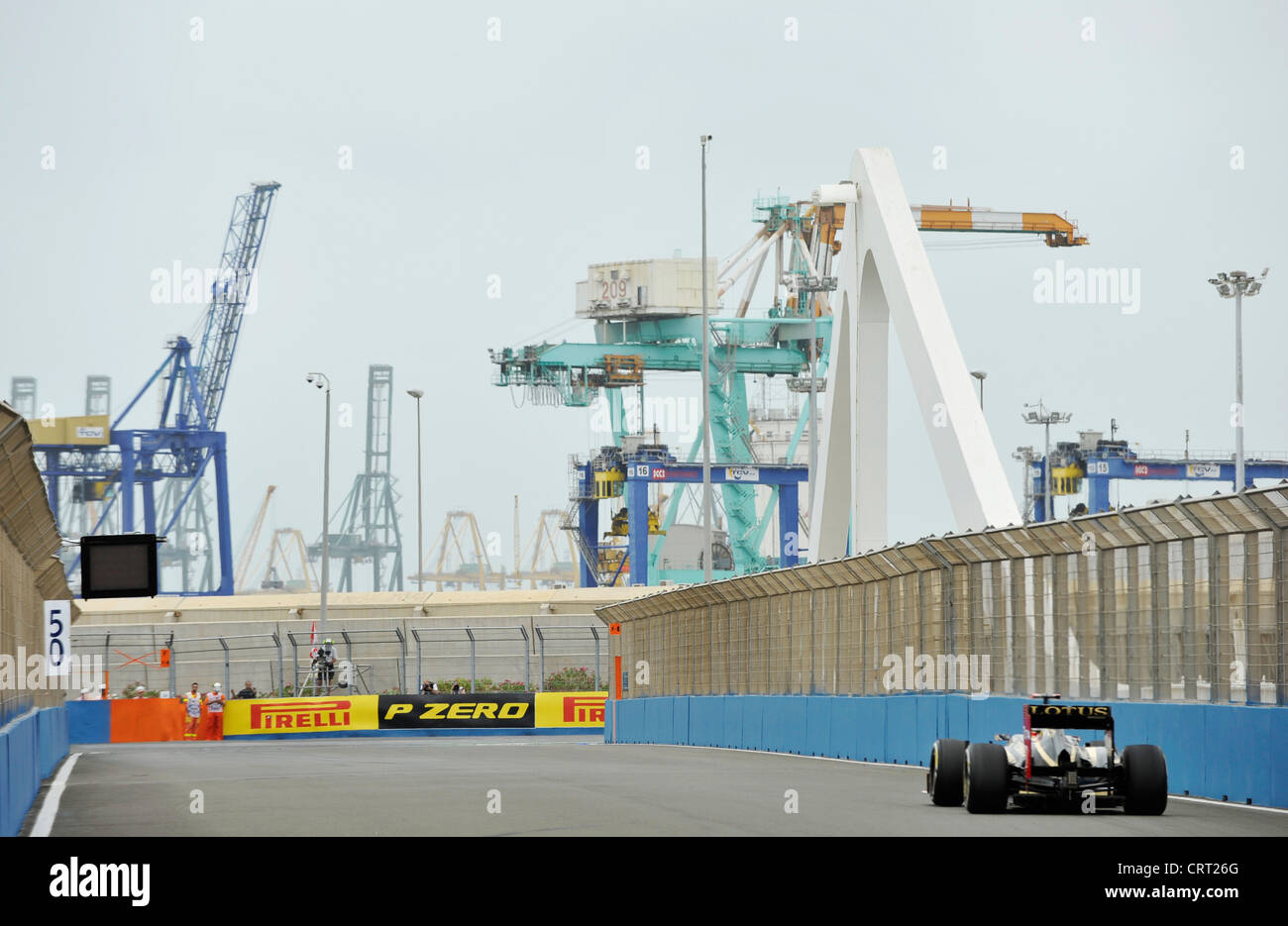race car on the bridge racing towards port cranes during free practice ...