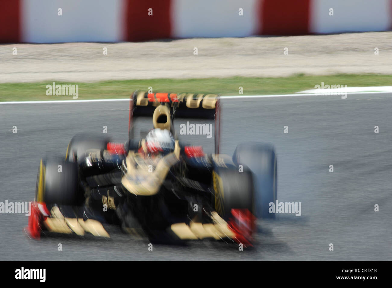 blurred Formula One race car during free practice for the Spanish ...