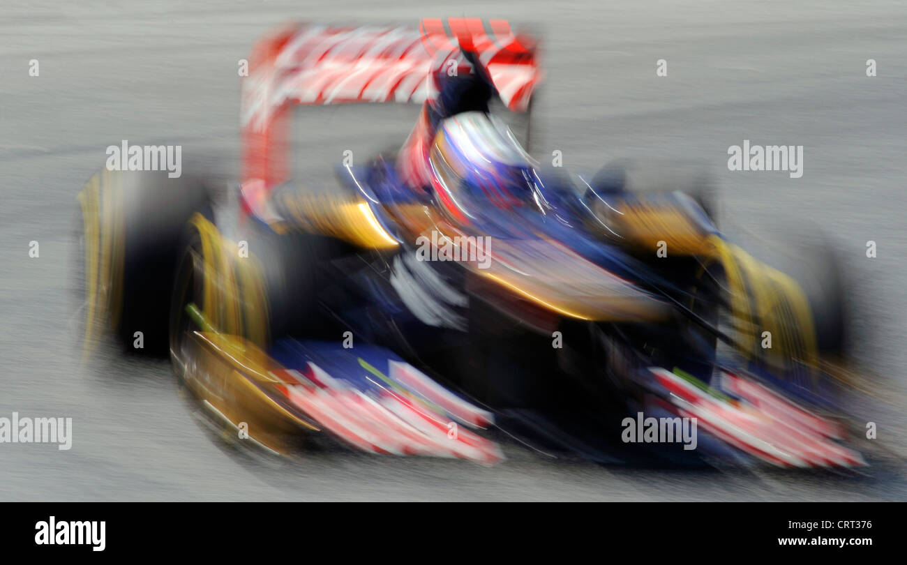 blurred Formula One race car during free practice for the Spanish ...