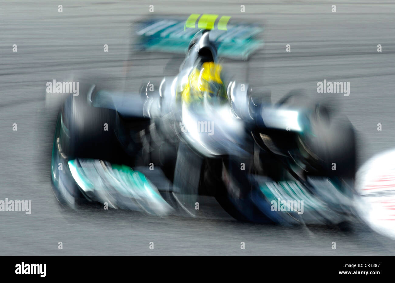 blurred Formula One race car during free practice for the Spanish ...