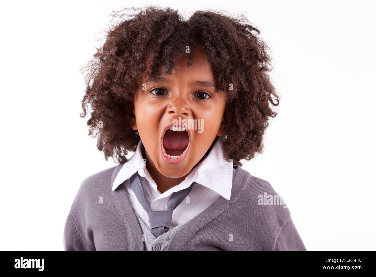 Portrait of a cute african little boy screaming,isolated on white ...
