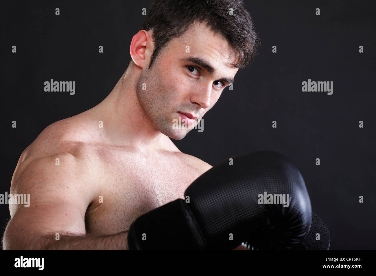Portrait sportsman boxer in studio against dark background Stock Photo ...