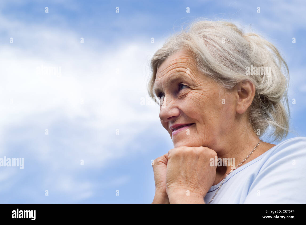 Beautiful older woman stands hi-res stock photography and images - Alamy