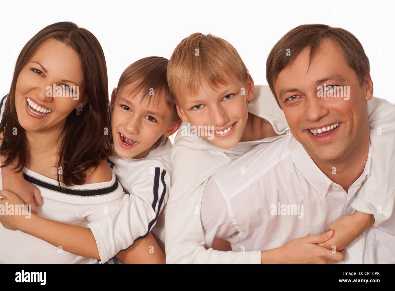 beautiful family of four on a light background Stock Photo - Alamy