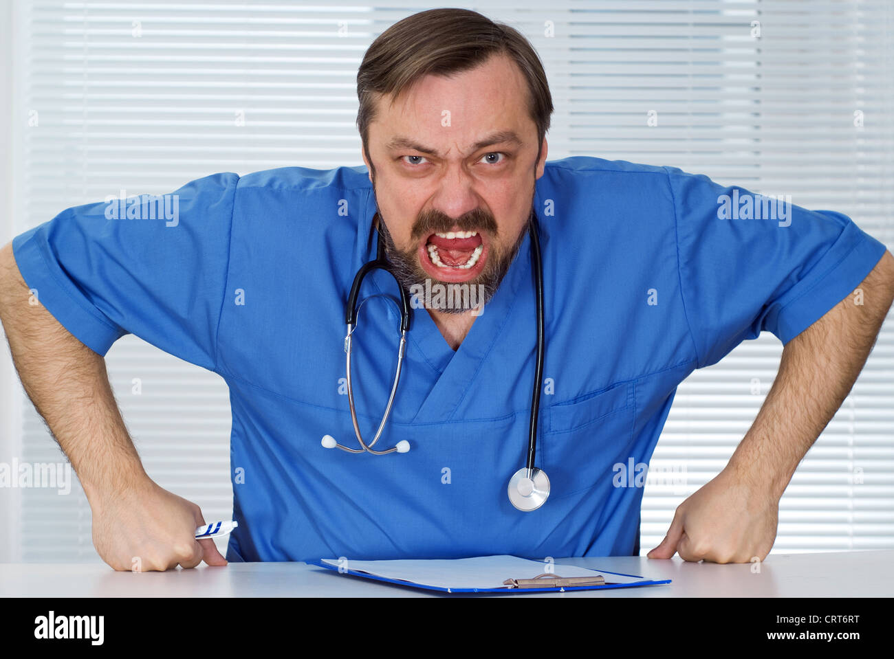 anger doctor sitting on the white background Stock Photo - Alamy