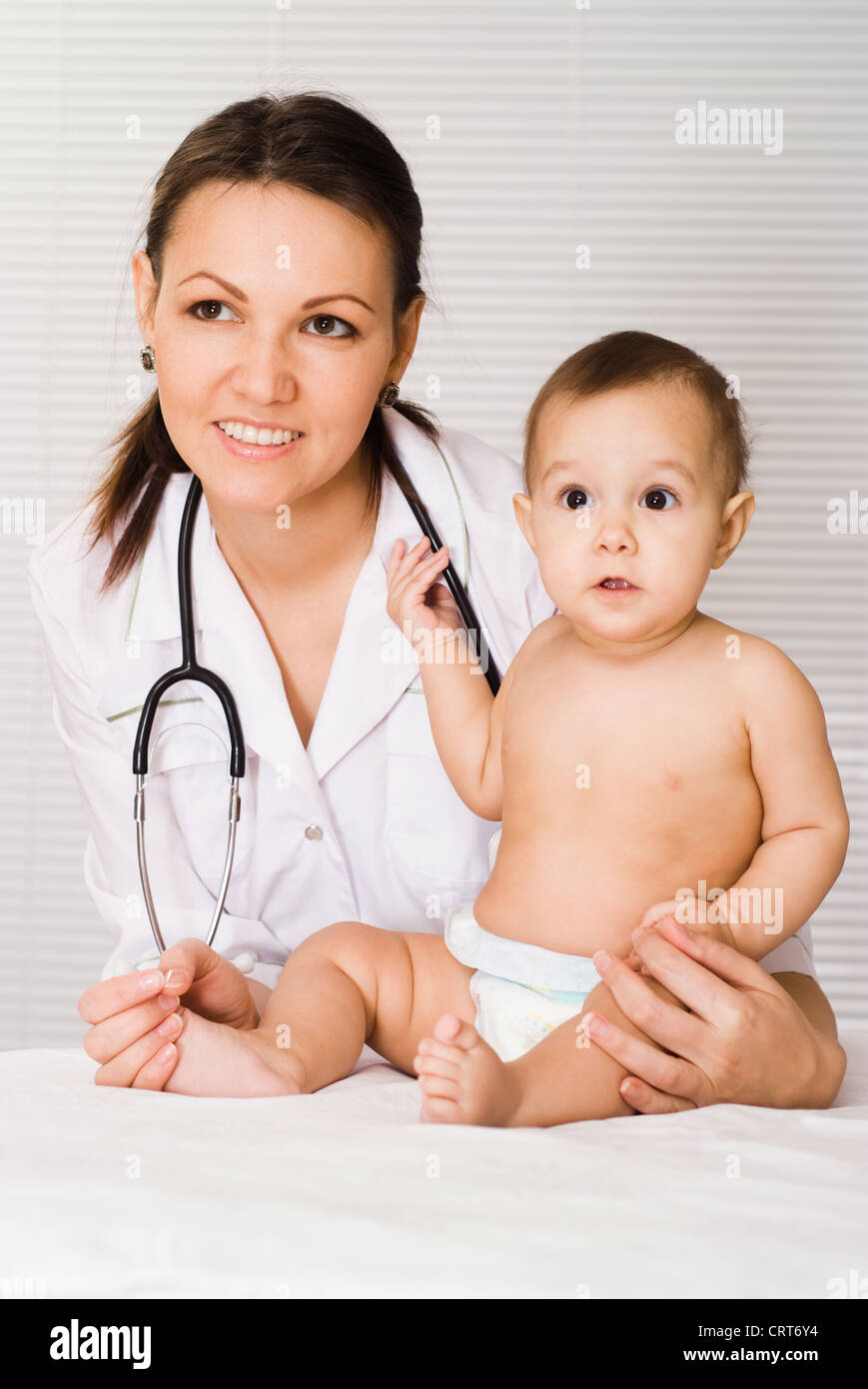 nice doctor and baby on a white background Stock Photo - Alamy