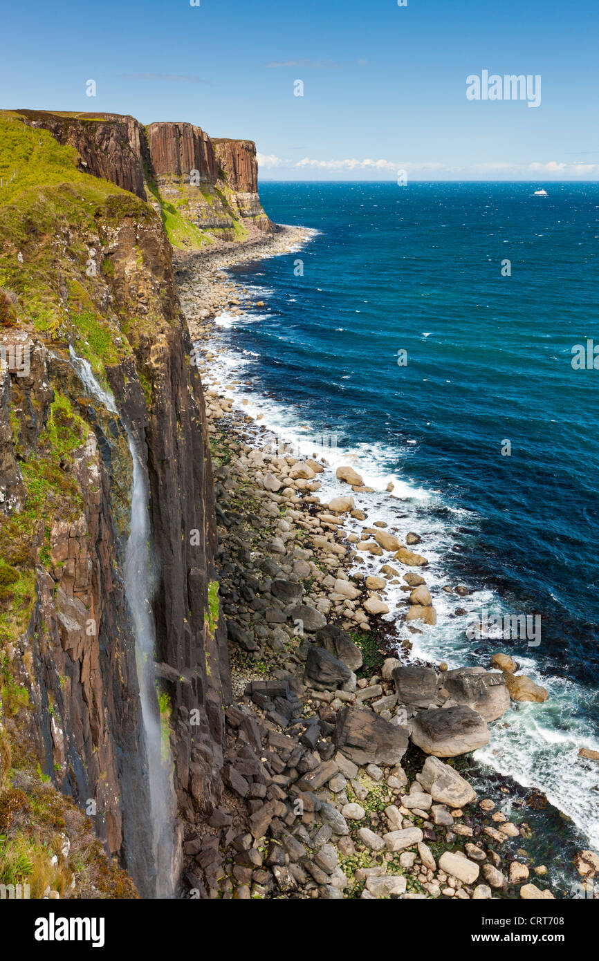 Waterfall flowing over the cliffs of the coast of Isle of Skye, Kilt ...