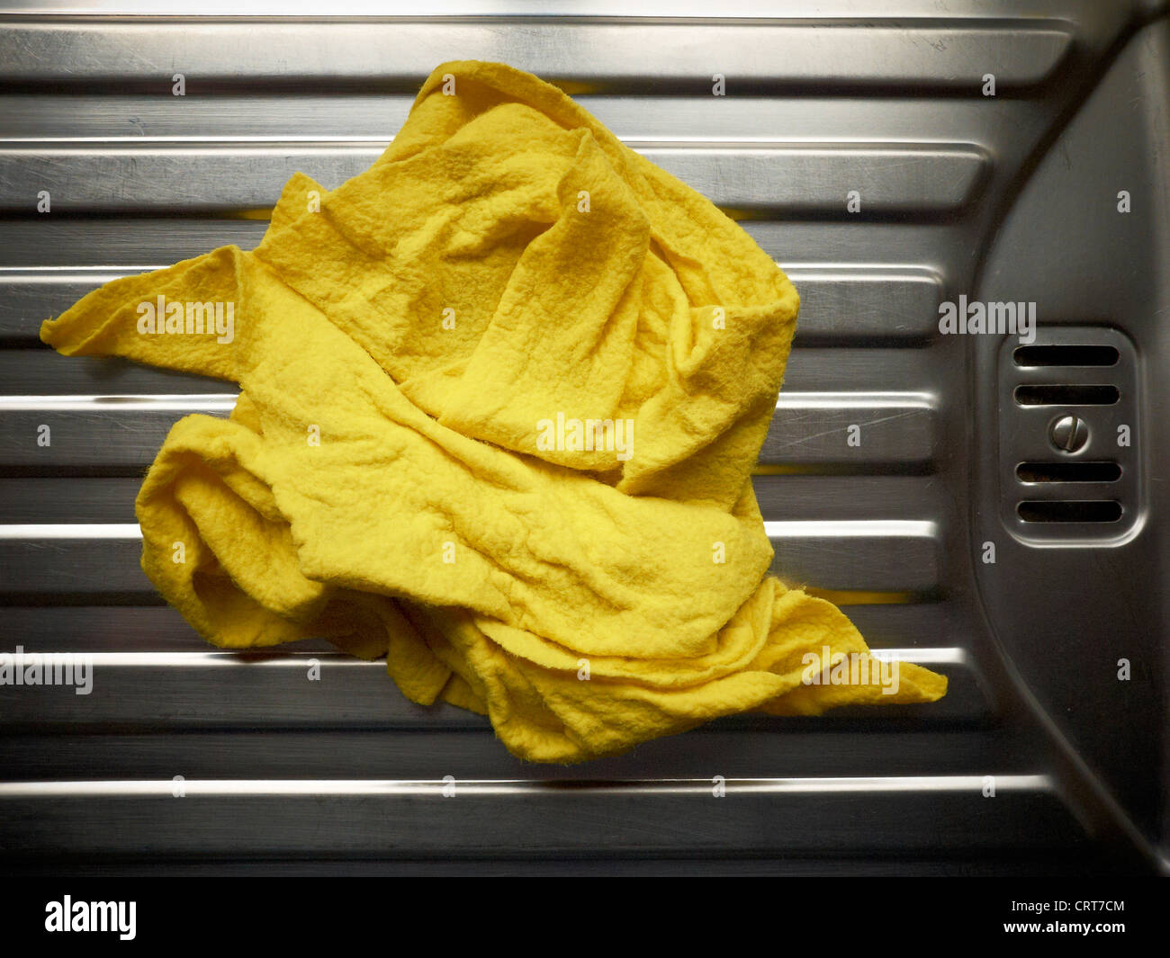 Yellow cloth on kitchen sink Stock Photo - Alamy