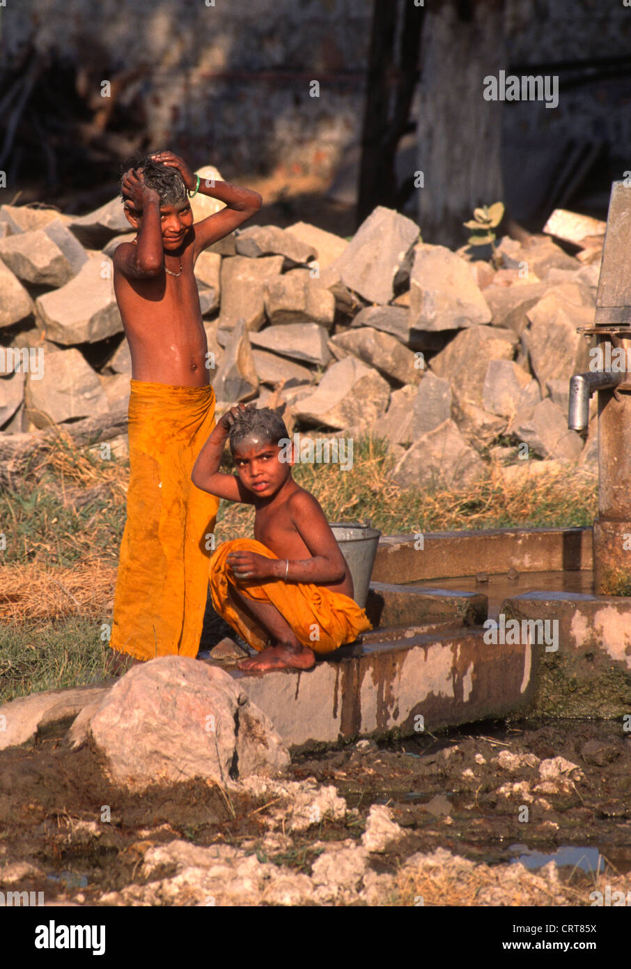 India, Rajasthan, boys bathing at a well Stock Photo - Alamy