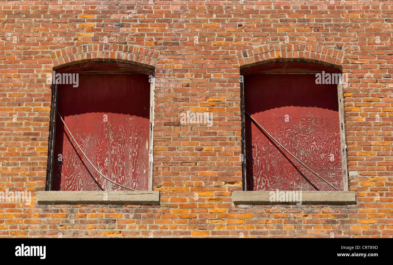 Old windows on a red brick wall Stock Photo - Alamy