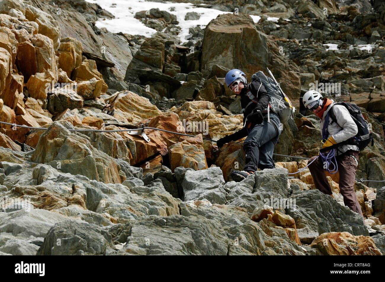 Two climbers descending the Gouter ridge on Mont Blanc Stock Photo - Alamy