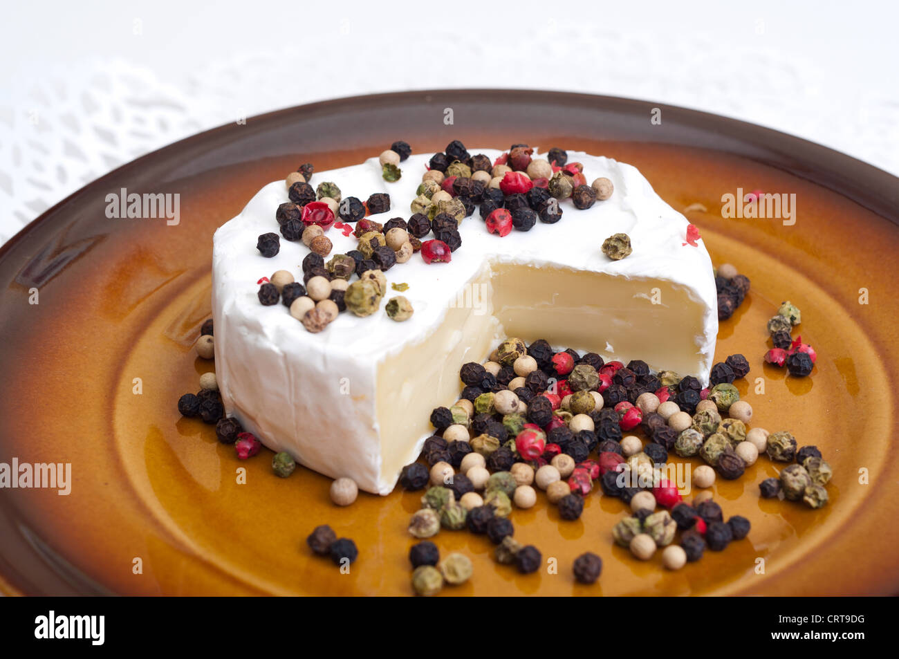 cheese camembert with color pepper spice Stock Photo - Alamy