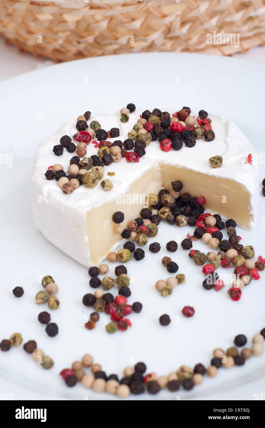 cheese camembert with color pepper spice Stock Photo - Alamy