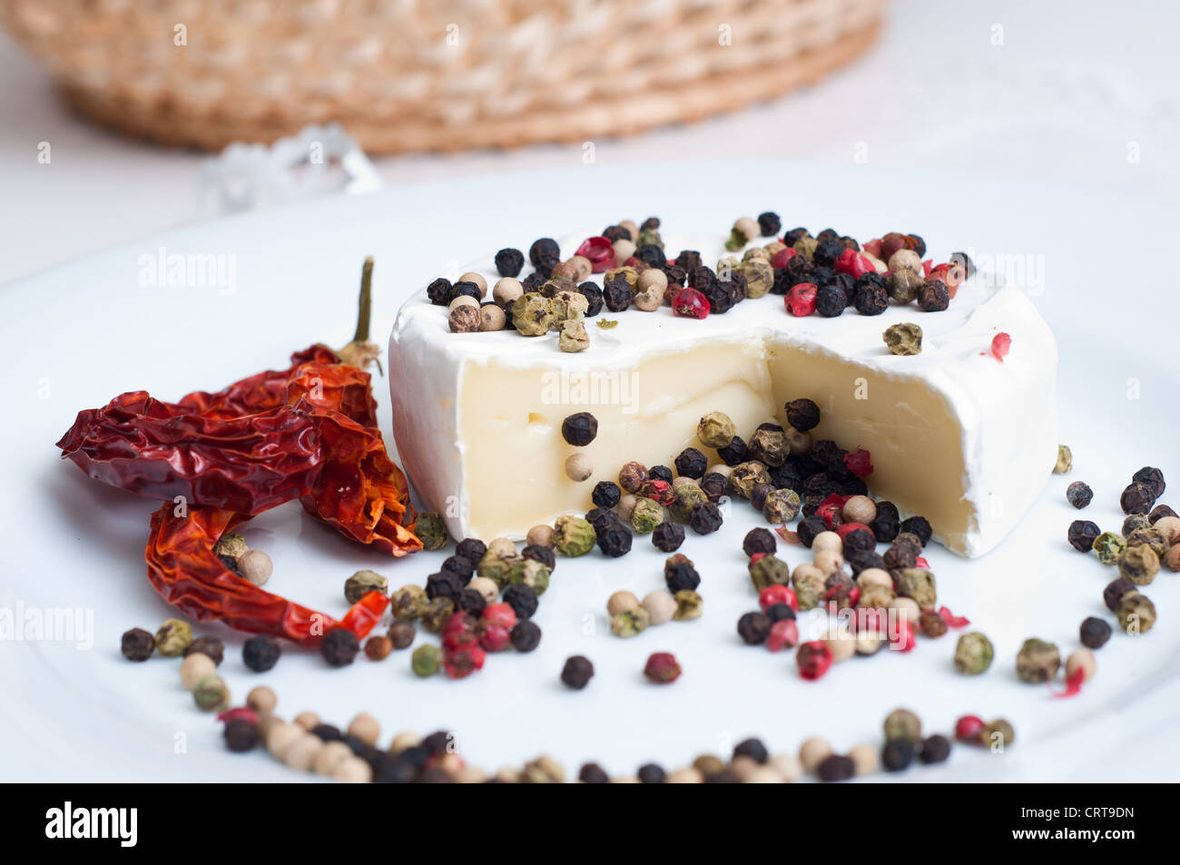 cheese camembert with color pepper spice Stock Photo - Alamy