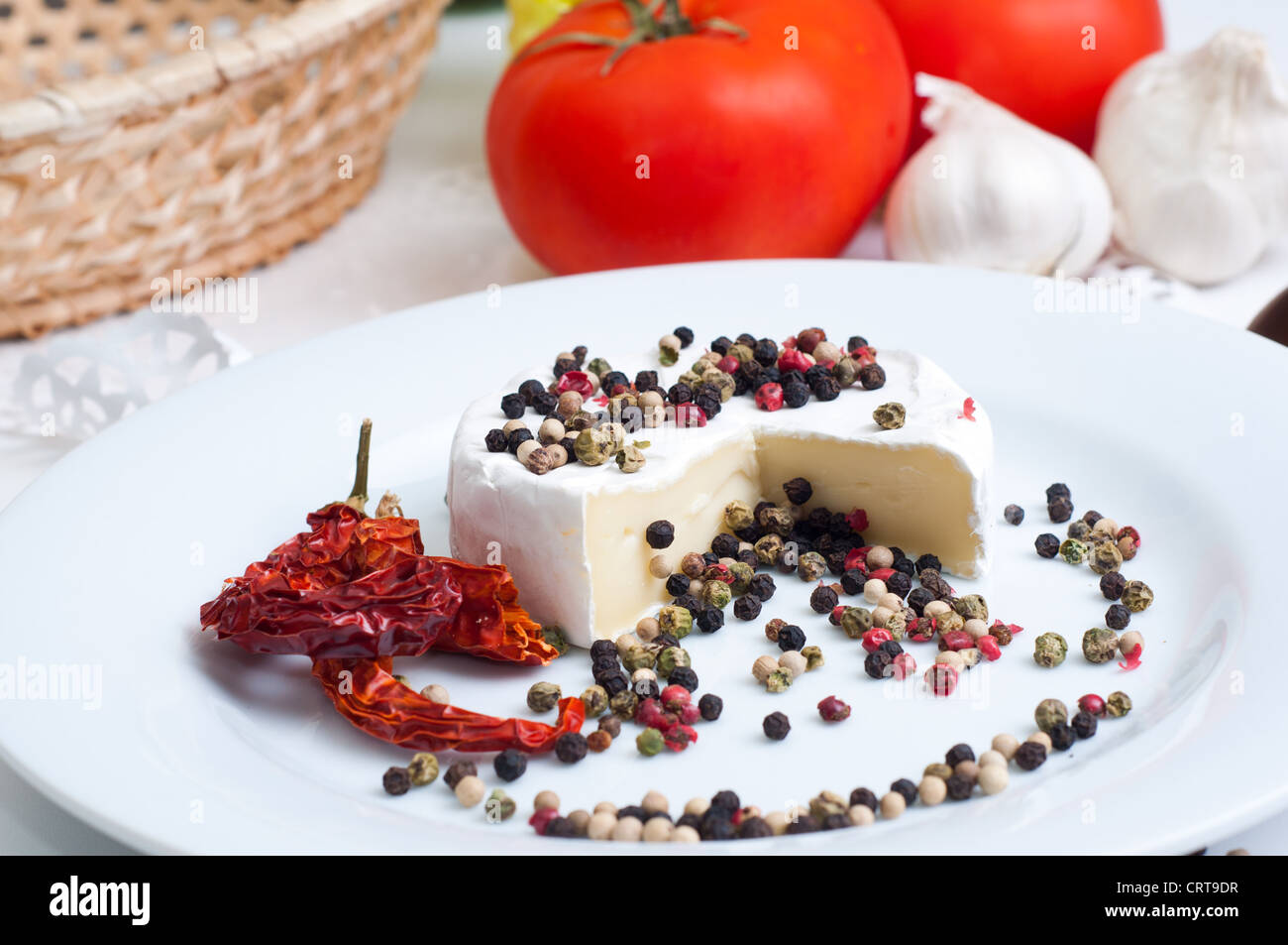 cheese camembert with color pepper spice Stock Photo - Alamy