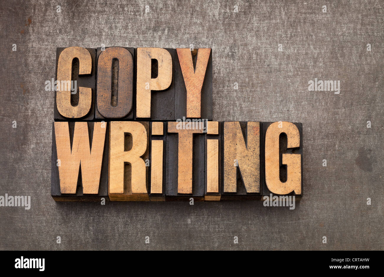 copywriting word - vintage letterpress wood type on a grunge metal ...