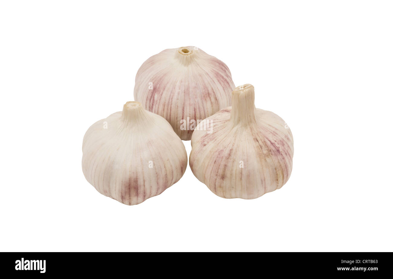 Closeup of three cloves of garlic. Isolated on white background Stock ...