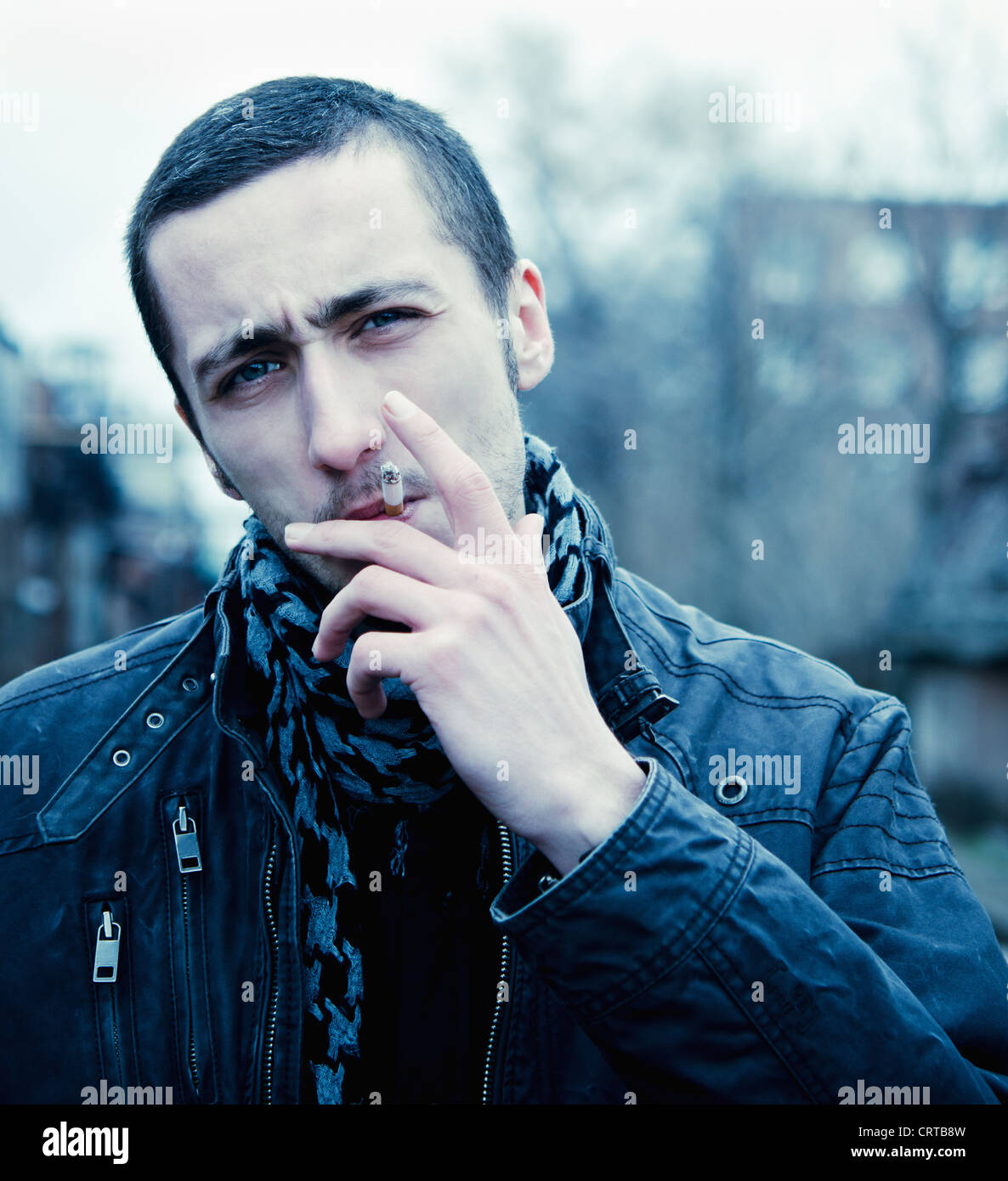 Closeup portrait of smoking handsome young man Stock Photo - Alamy
