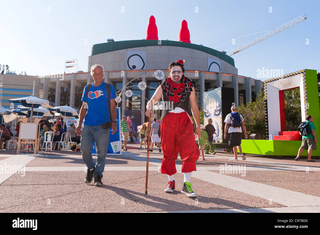 Zany character with a tiny hat on Esplanade of Place des Arts, during ...