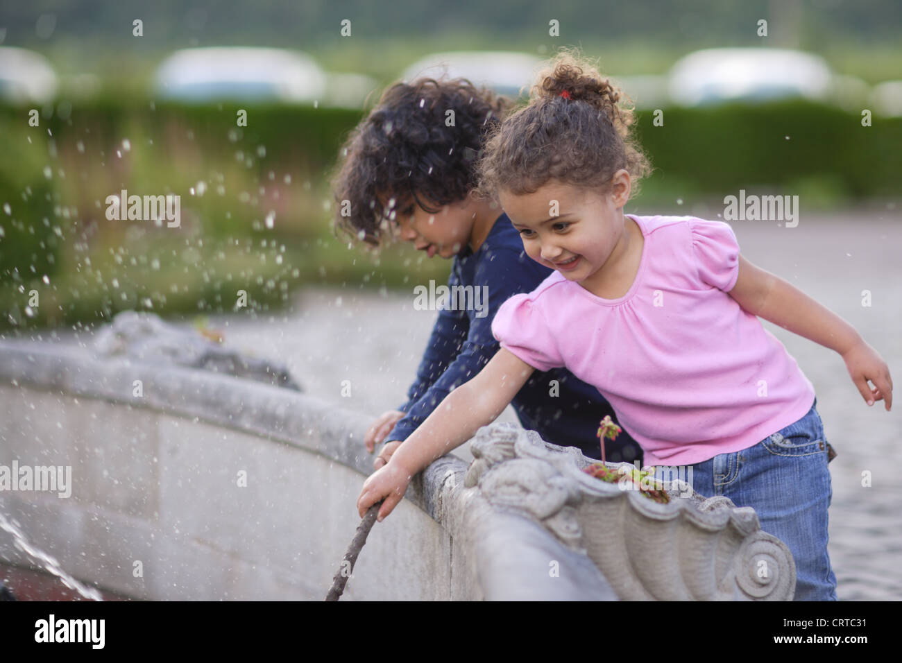 children playing in fountain Stock Photo - Alamy