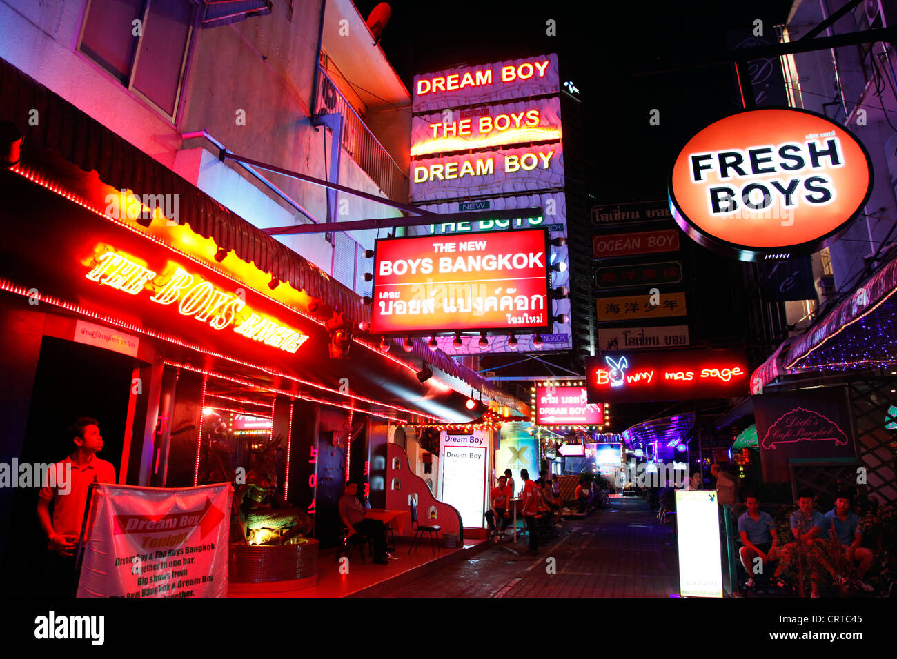 Neon lights and signs for gogo boys and bars in Soi Twilight in the red ...