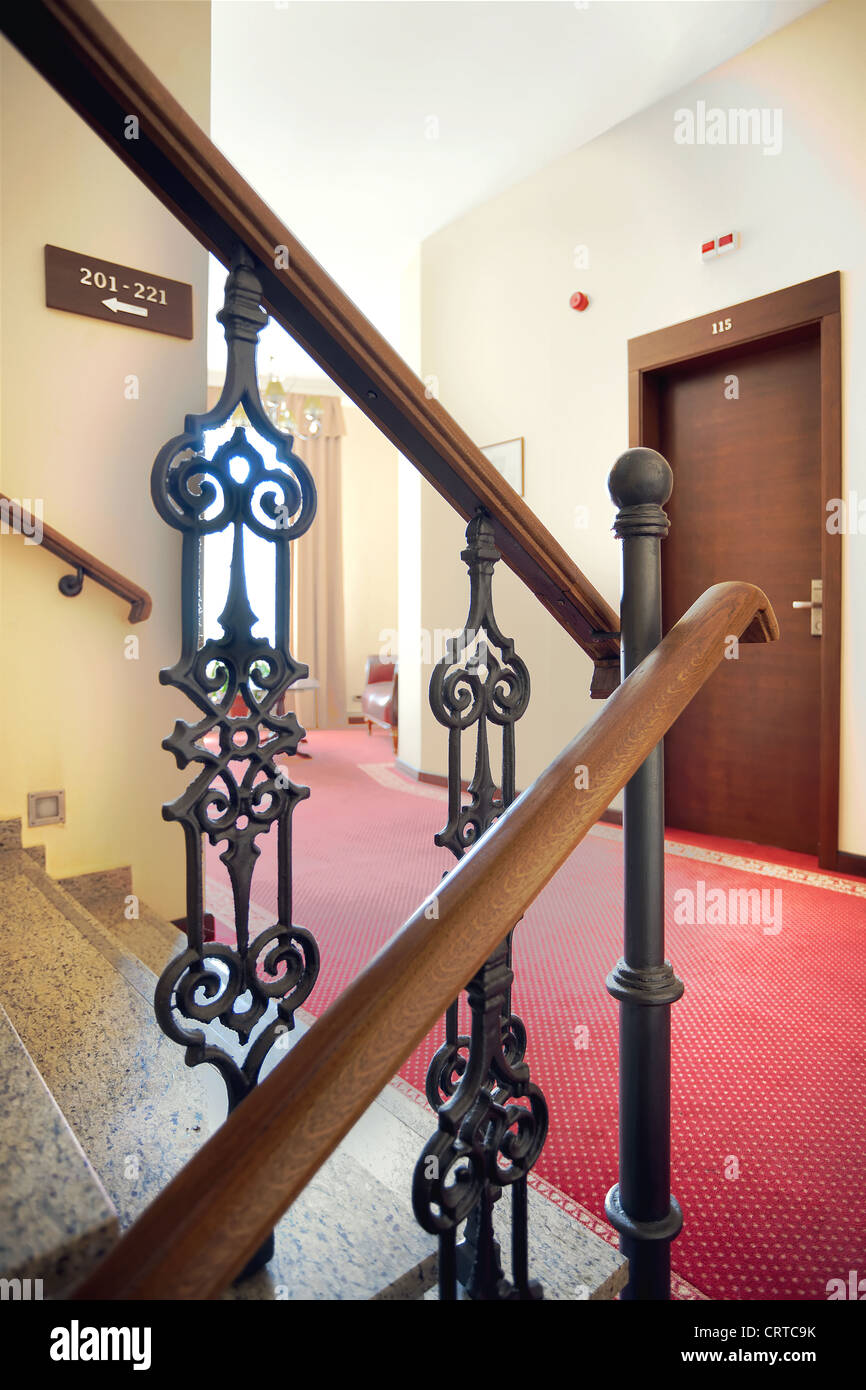 Interior of a hotel, view on stairs gate Stock Photo - Alamy