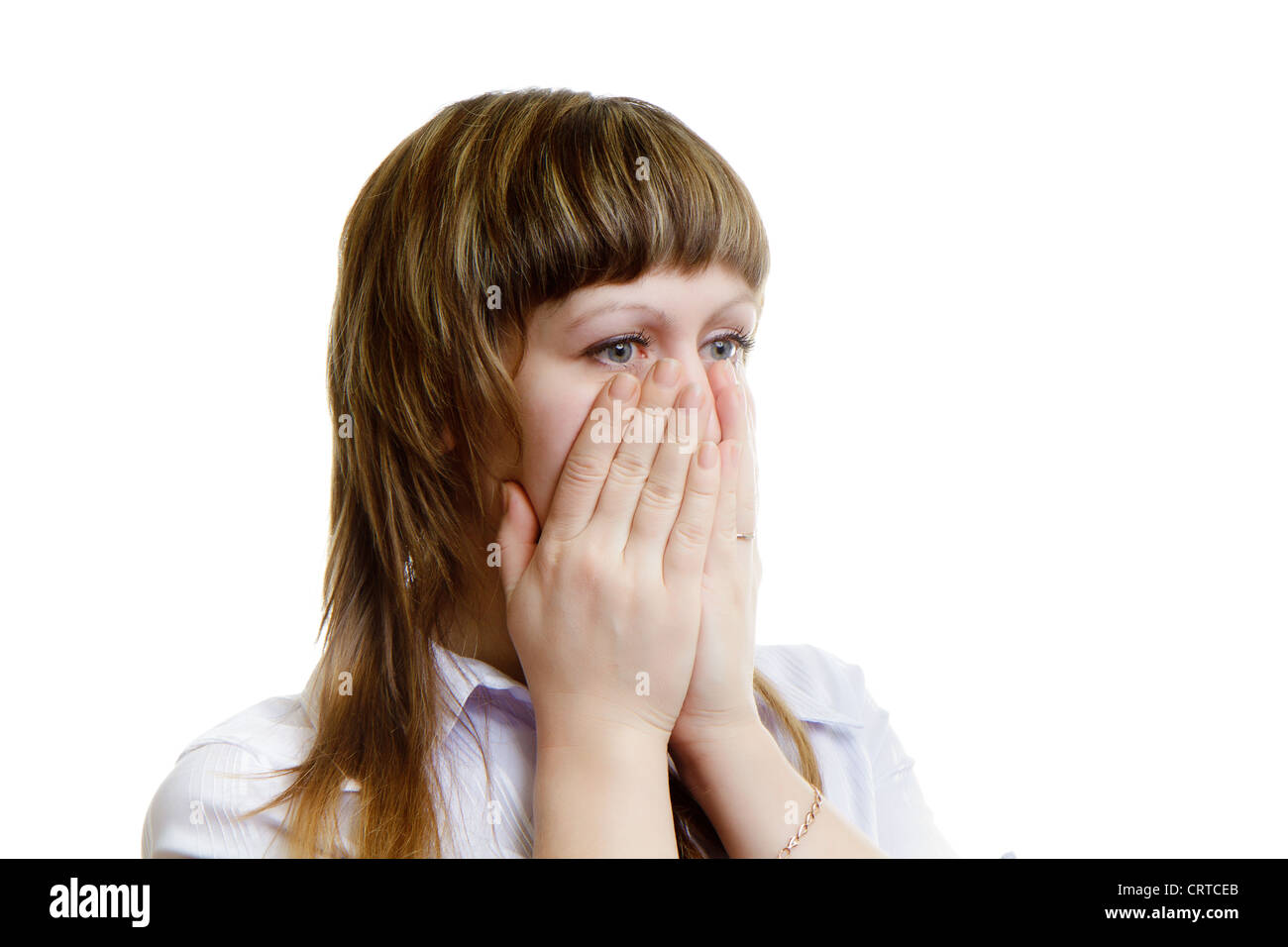 frightened young woman on a white background Stock Photo - Alamy