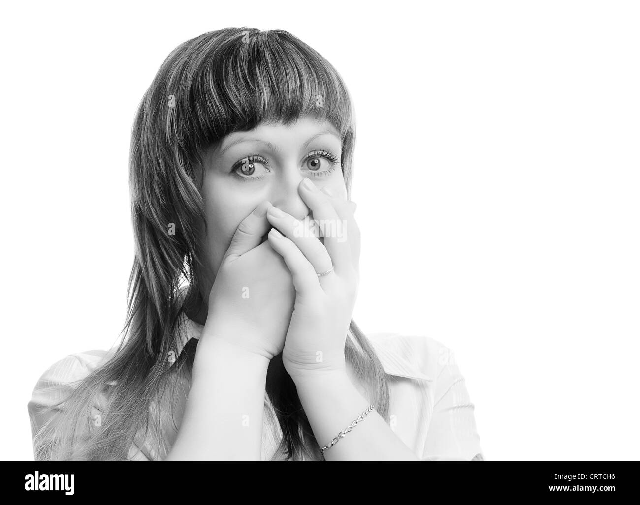 frightened young woman on a white background Stock Photo - Alamy