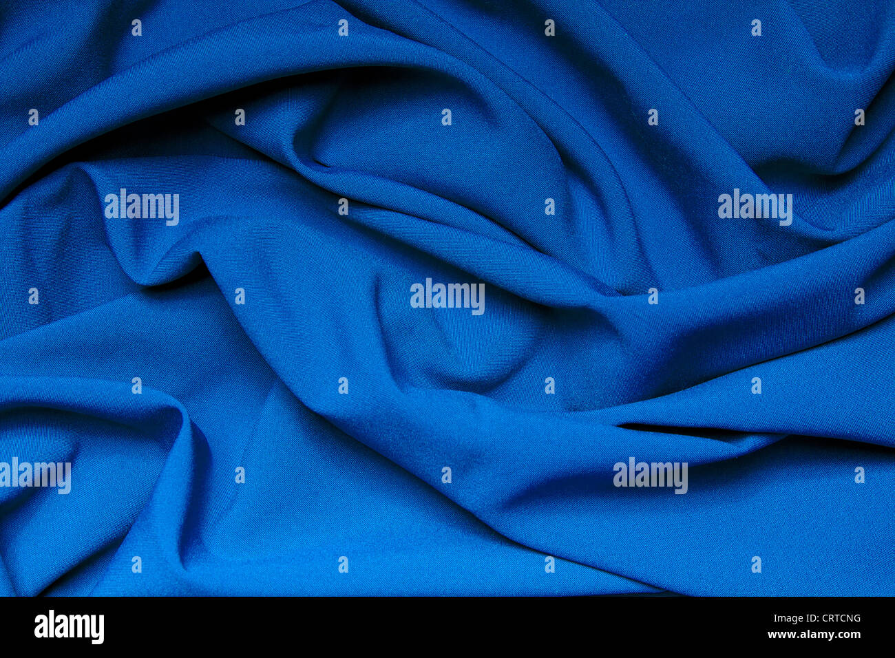 The folds of a bright blue cloth. Abstract Background Stock Photo - Alamy