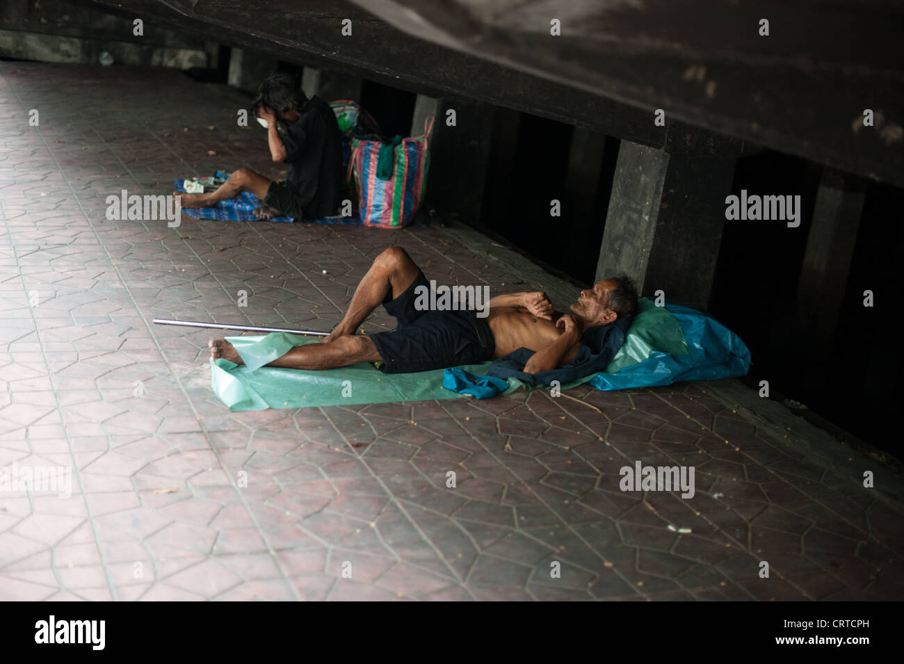 Homeless people sleeping under bridge hi-res stock photography and ...