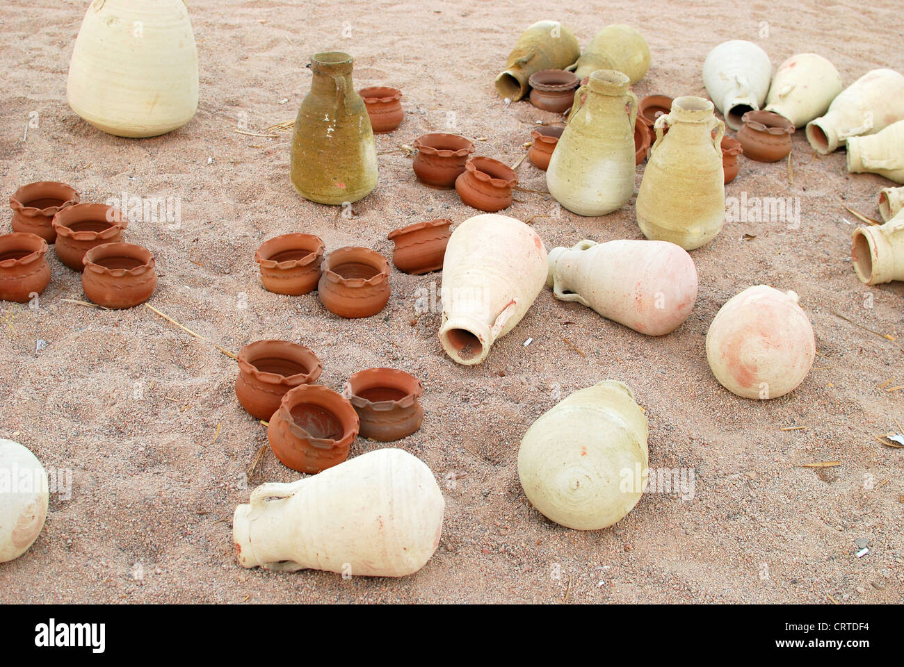 clay pots on a sand Stock Photo - Alamy