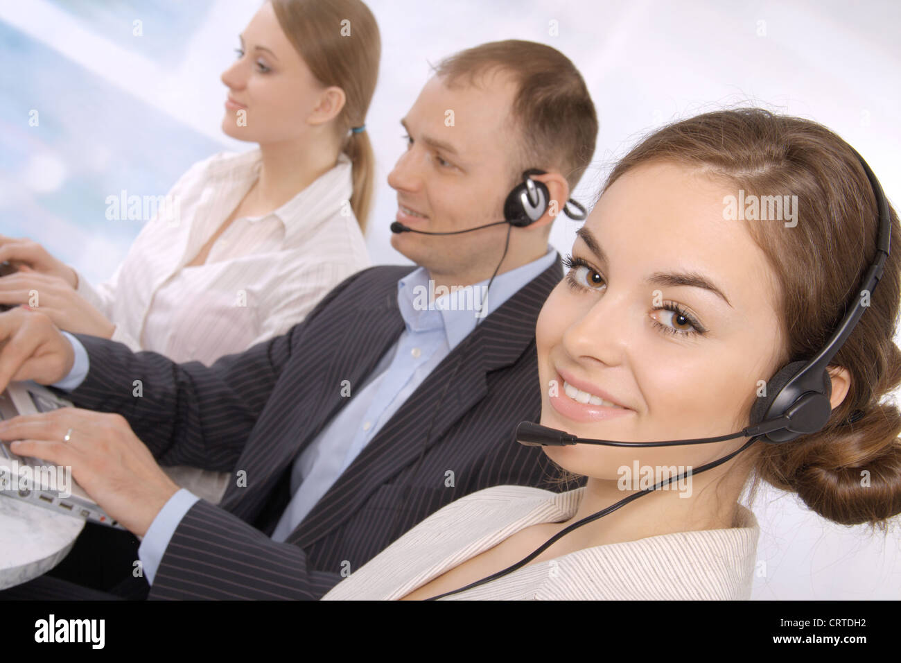 Group of successful customer service people, with focus on a female ...