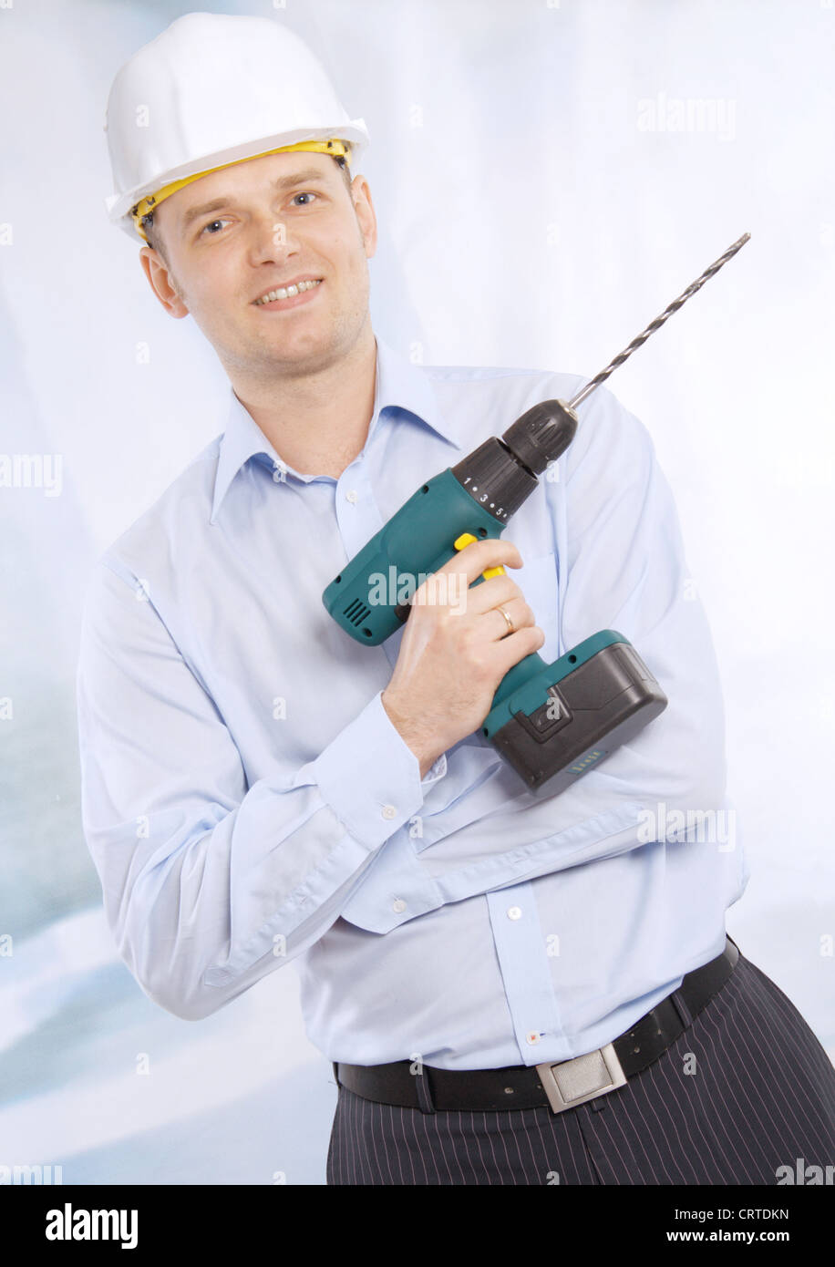 Successful worker with a cordless drill Stock Photo - Alamy