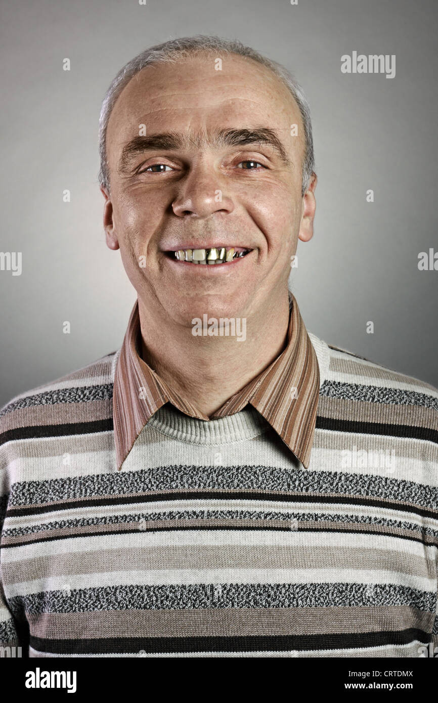 Portrait of a real man in the studio on a gray background Stock Photo ...