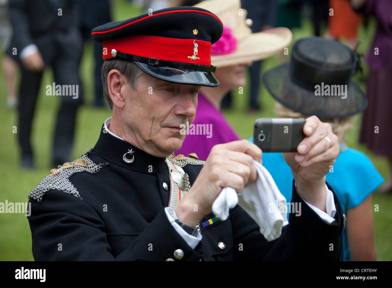Captain in the Royal Signals (Berkshire Yeomanry) taking a photograph ...