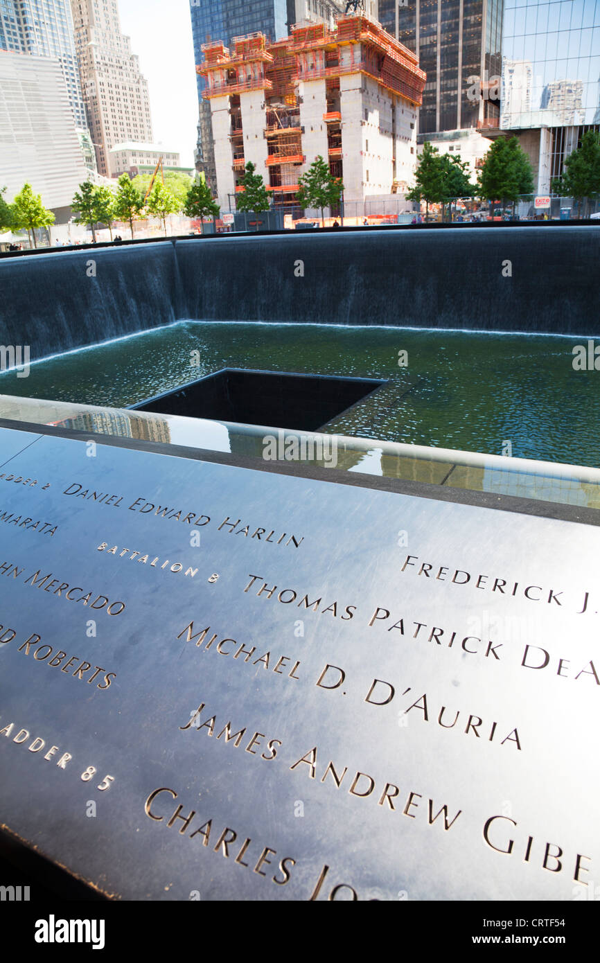 9/11 memorial at ground zero, waterfalls with names inscribed around ...
