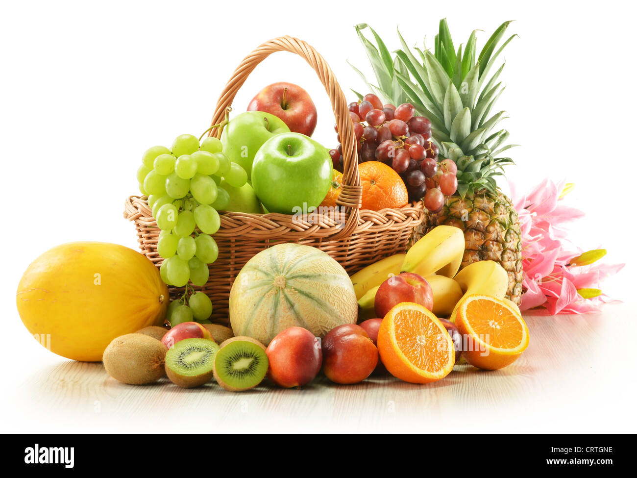 Composition with assorted fruits in wicker basket Stock Photo - Alamy